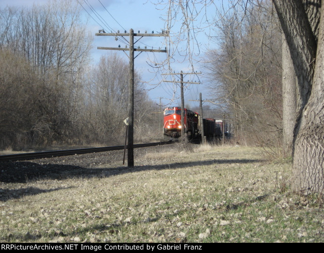 CN 2719 coming up close to the camera with a loud horn and wave from the conductor on the next ...